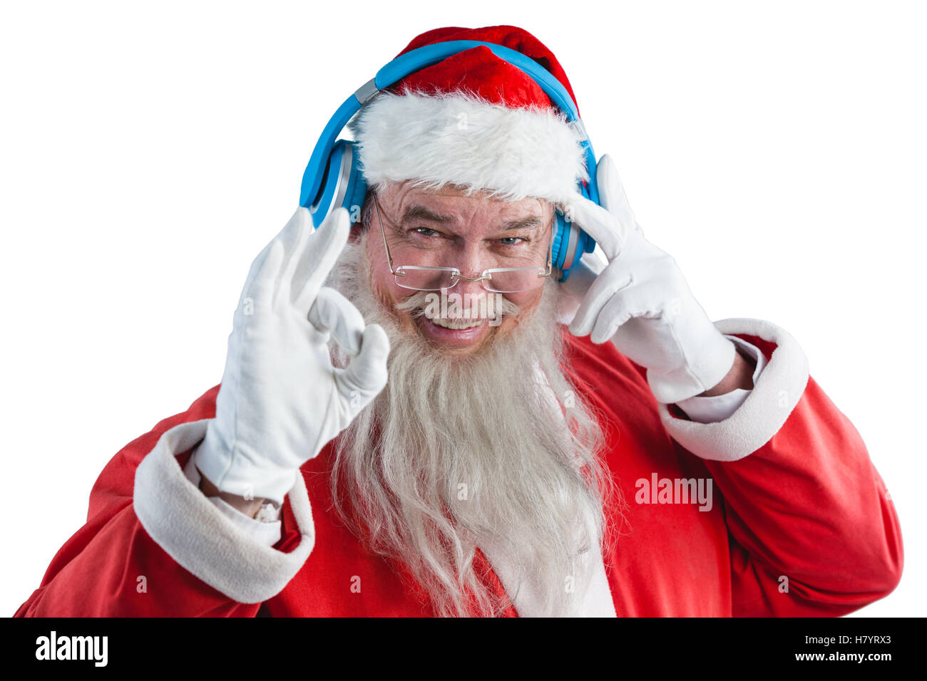 Santa claus showing hand okay sign while listening to music on ...