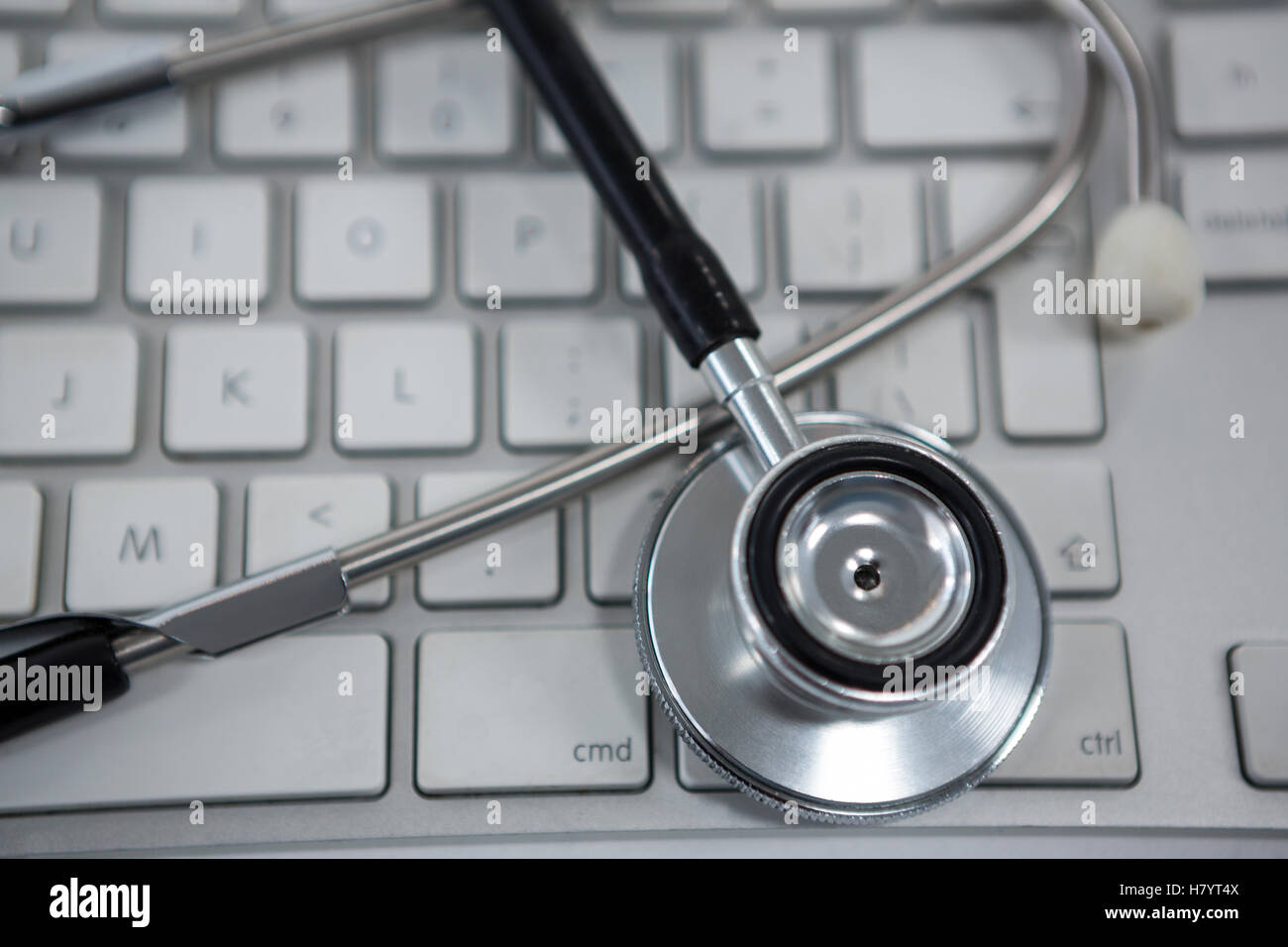 Stethoscope on laptop Stock Photo - Alamy
