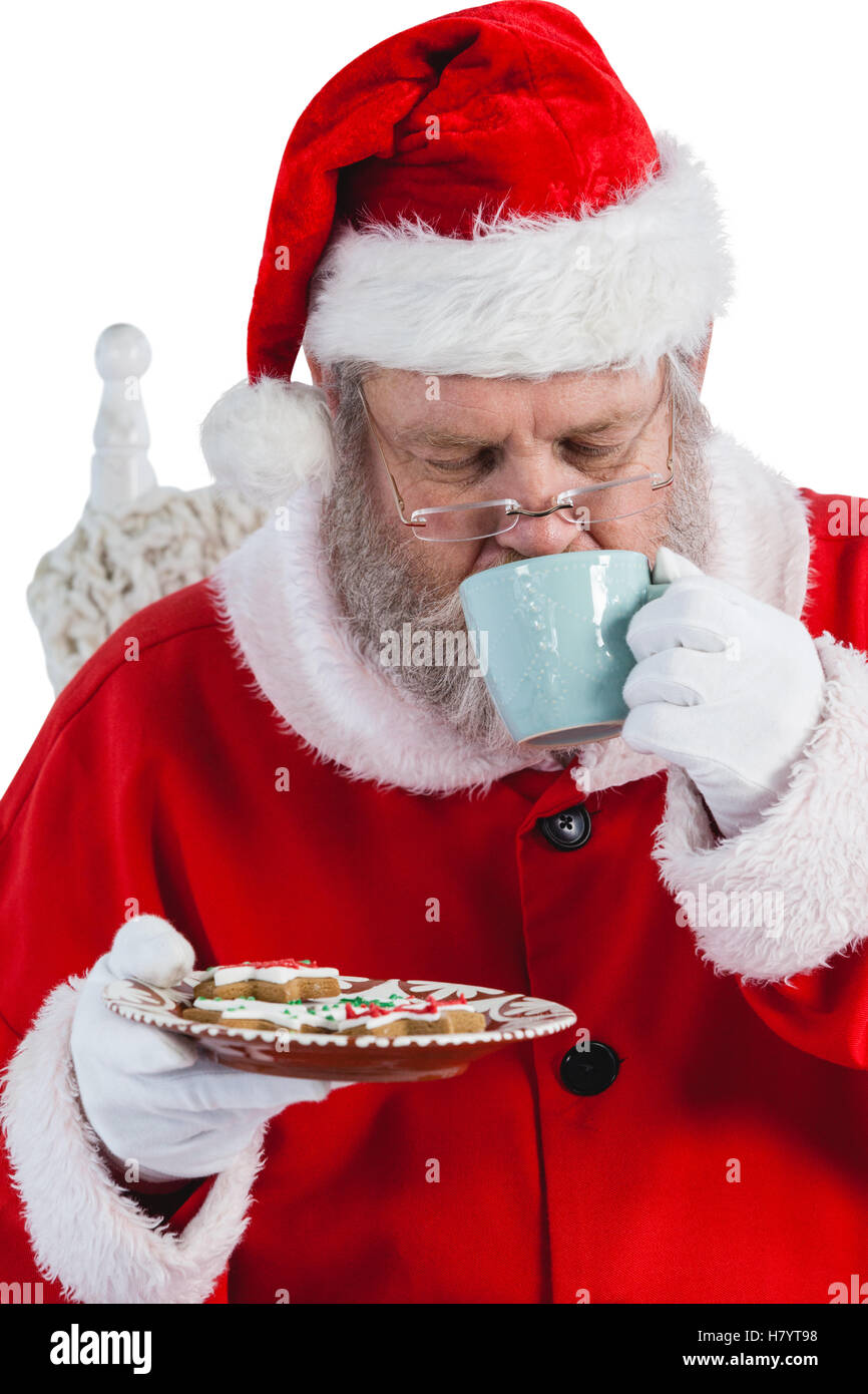 Santa claus having a cup of coffee Stock Photo - Alamy