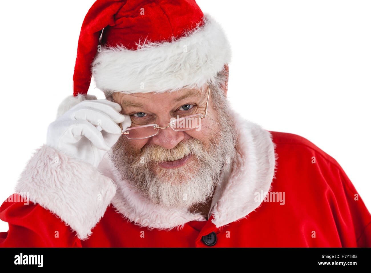 Santa claus looking through spectacles Stock Photo - Alamy