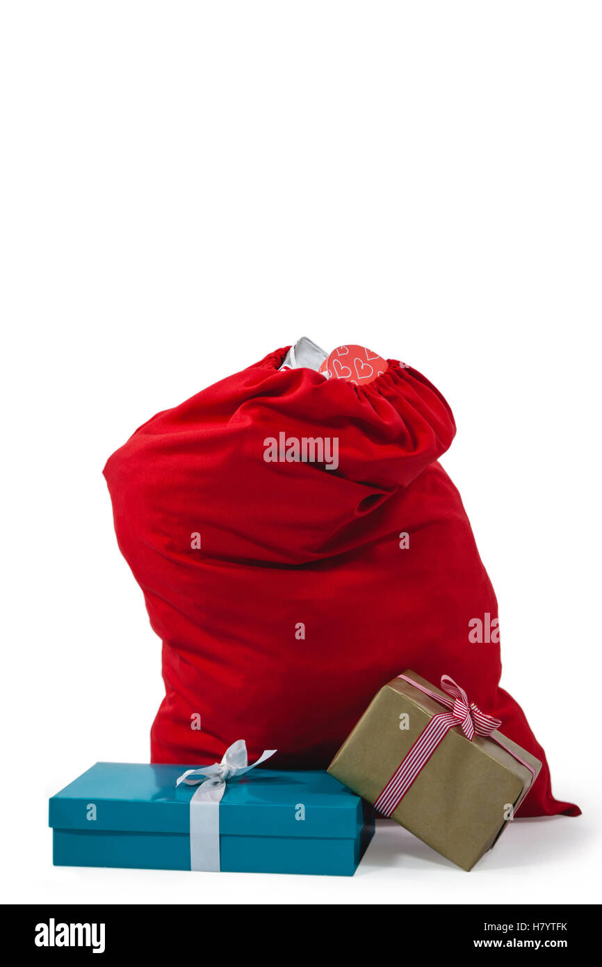 Christmas presents with santa sack Stock Photo - Alamy