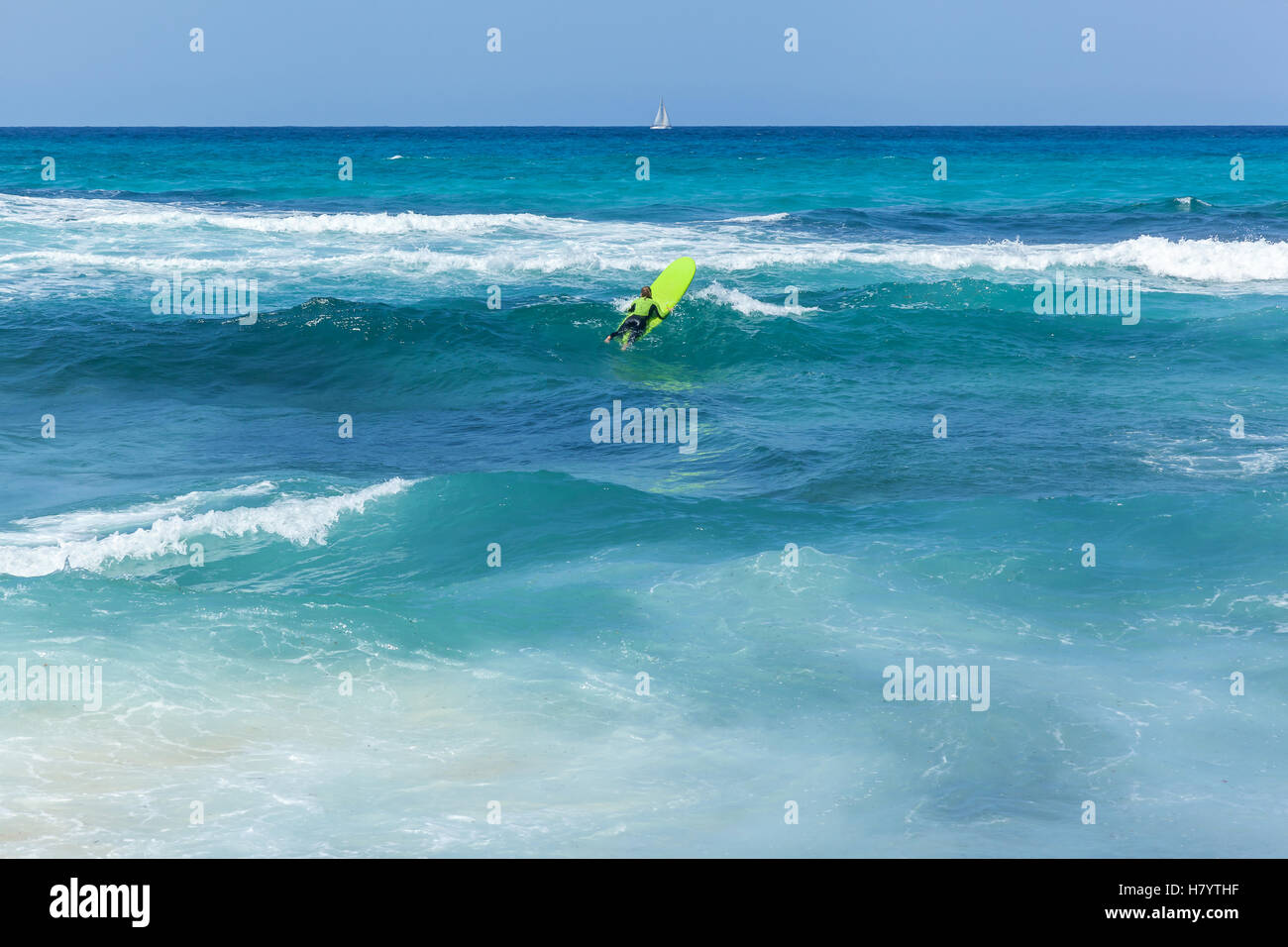 Surfing at the sea. Beautiful coast of Mallorca, Spain, the surfer ...