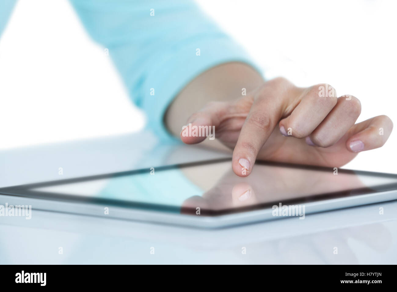 Hand using digital tablet against white background Stock Photo - Alamy