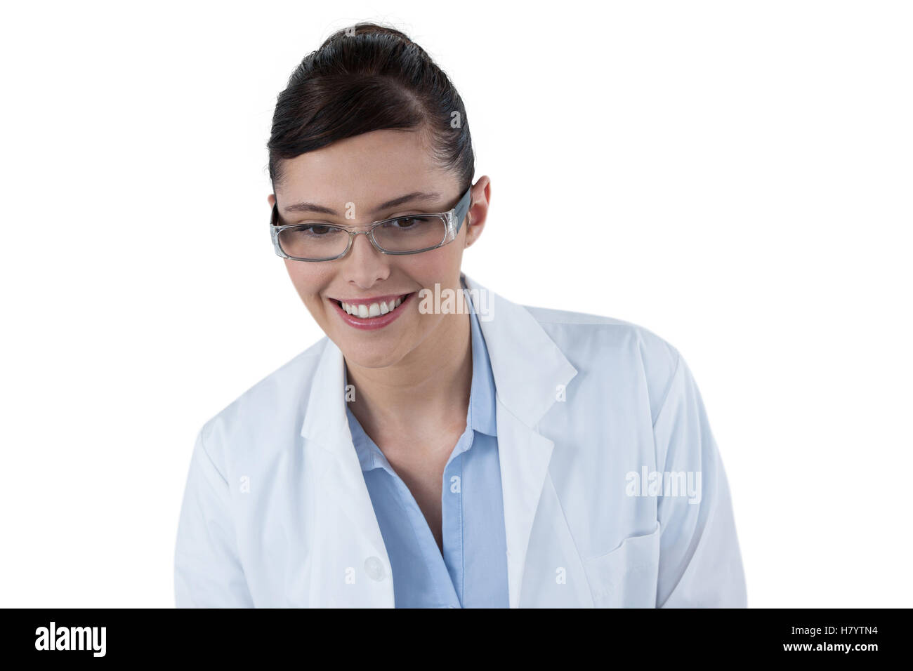 Female doctor smiling against white background Stock Photo - Alamy