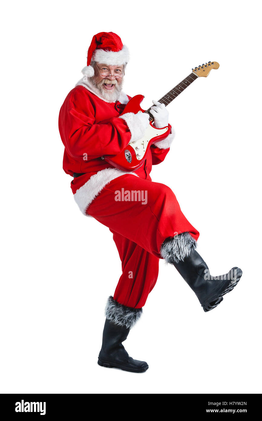Smiling santa claus playing a guitar Stock Photo - Alamy