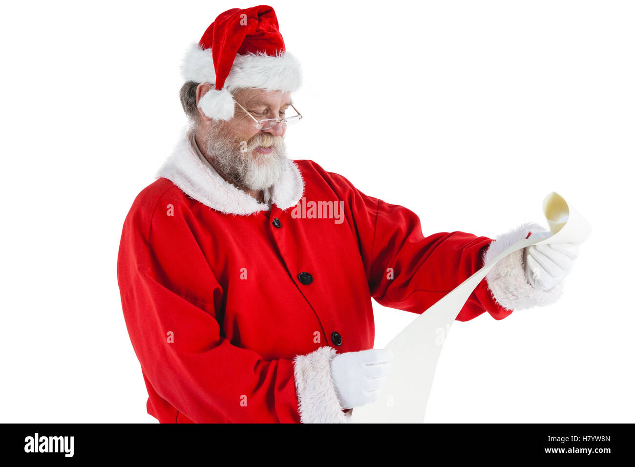 Santa claus smiling and reading a scroll Stock Photo - Alamy