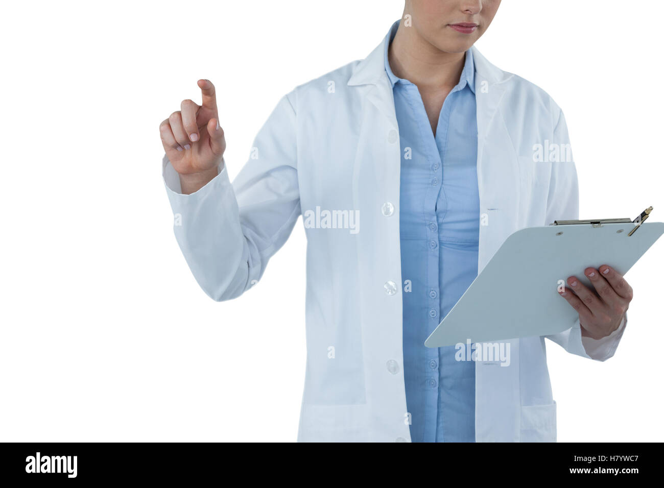 Mid section of female doctor using digital screen while holding ...