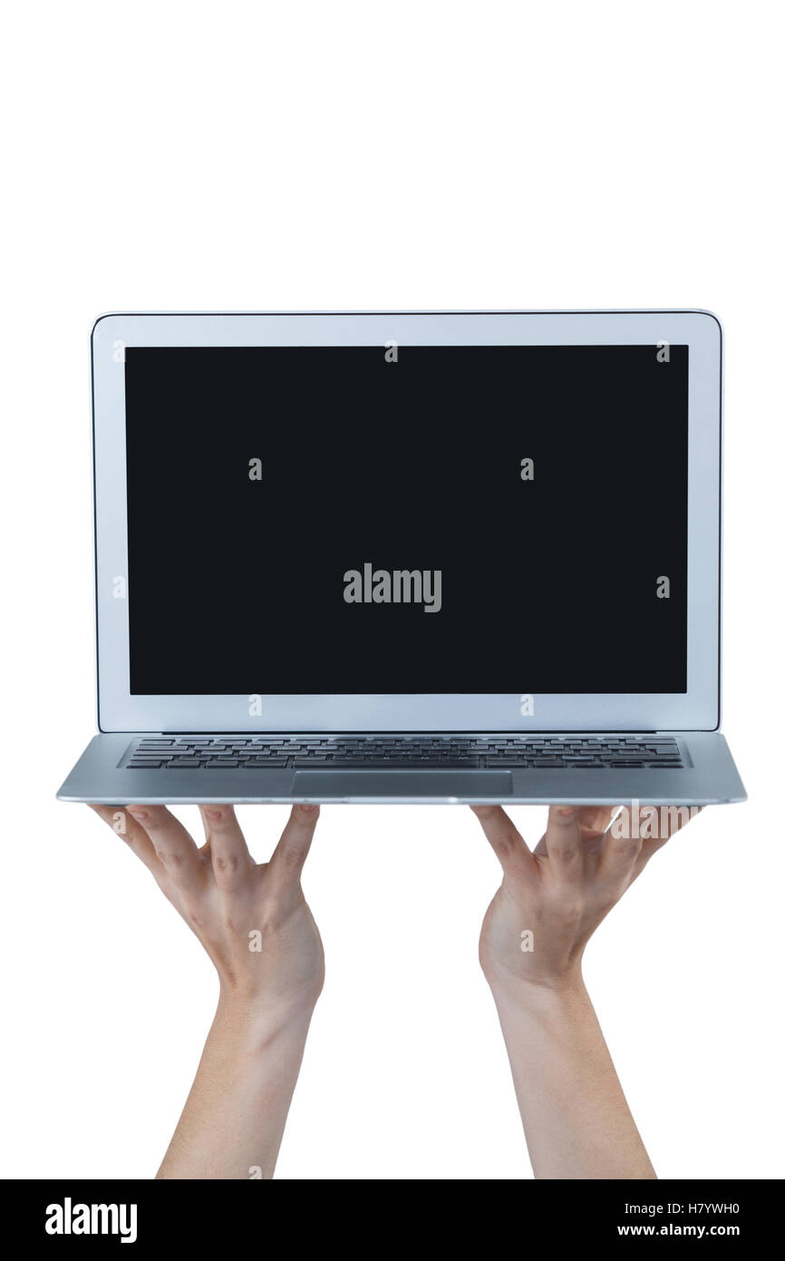 Hands holding laptop against white background Stock Photo - Alamy