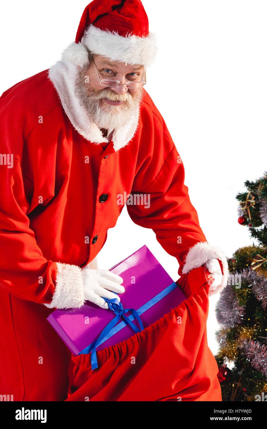 Happy santa man putting hi-res stock photography and images - Alamy