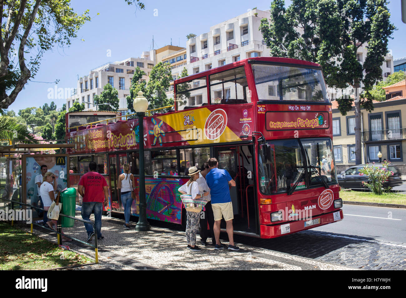 Red tourist bus in Funchal, Madeira, Portugal Stock Photo - Alamy
