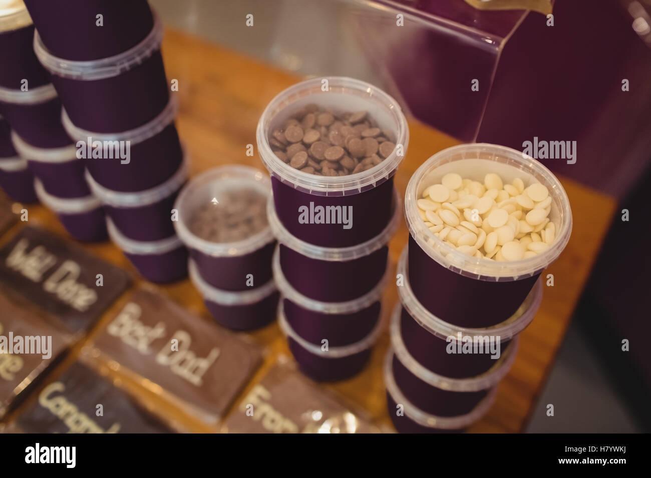 Stacked chocolate containers in display Stock Photo - Alamy