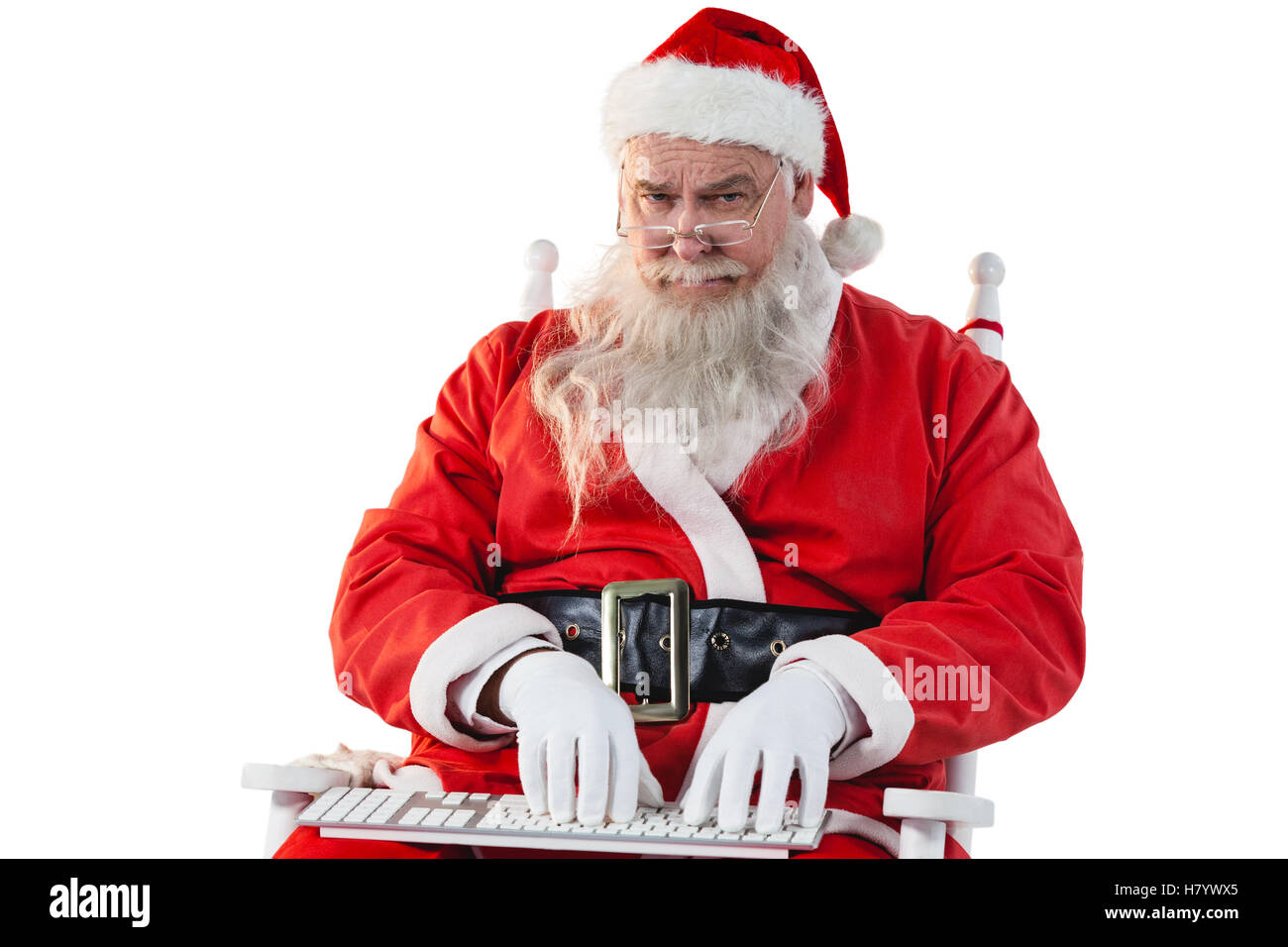 Santa claus typing keyboard against white background Stock Photo - Alamy