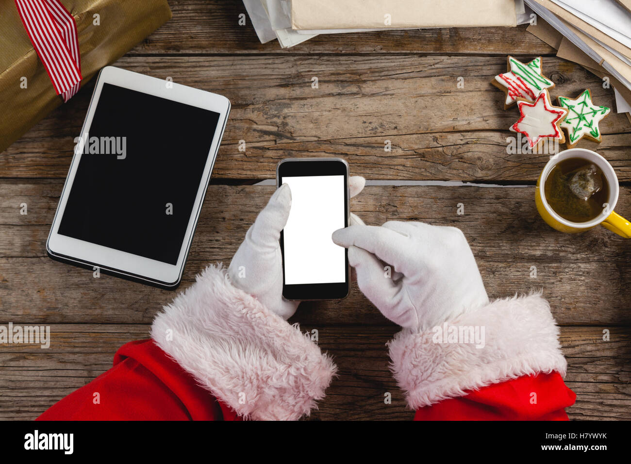 Santa claus using mobile phone Stock Photo - Alamy