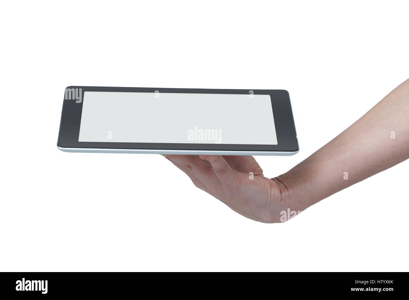 Hand holding digital tablet against white background Stock Photo - Alamy
