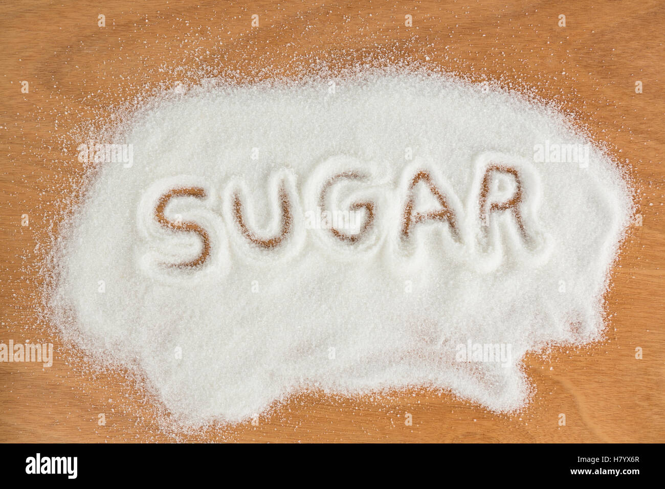 Sugar written on sugar powder Stock Photo - Alamy