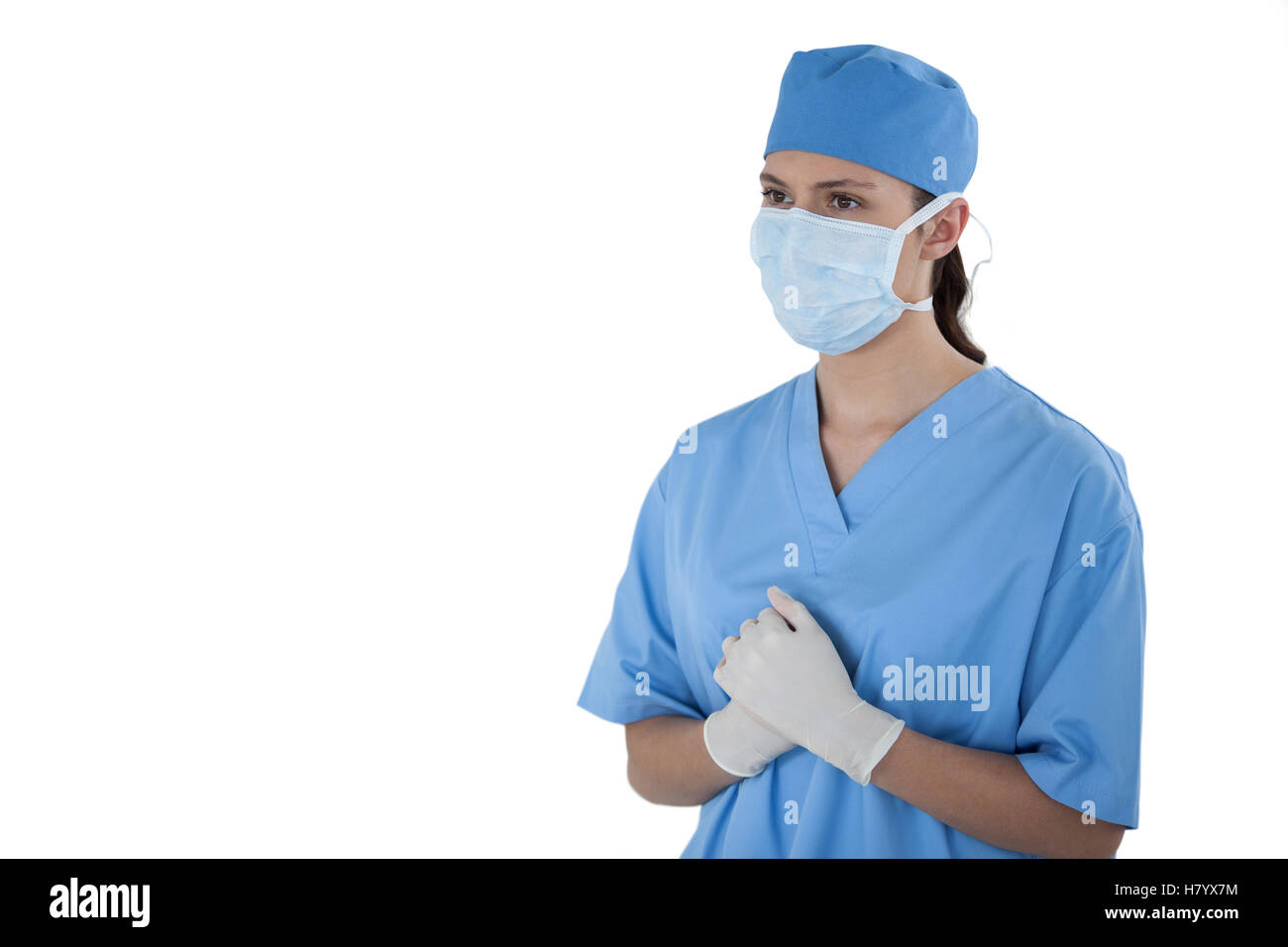 Female surgeon standing against white background Stock Photo - Alamy