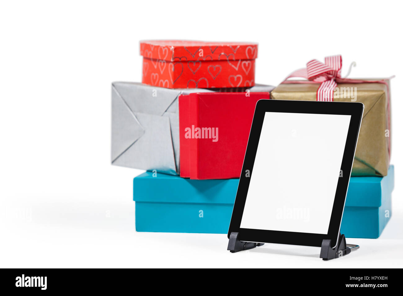Christmas presents with digital tablet Stock Photo - Alamy