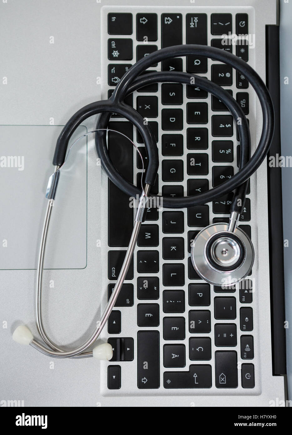 Stethoscope on laptop Stock Photo - Alamy