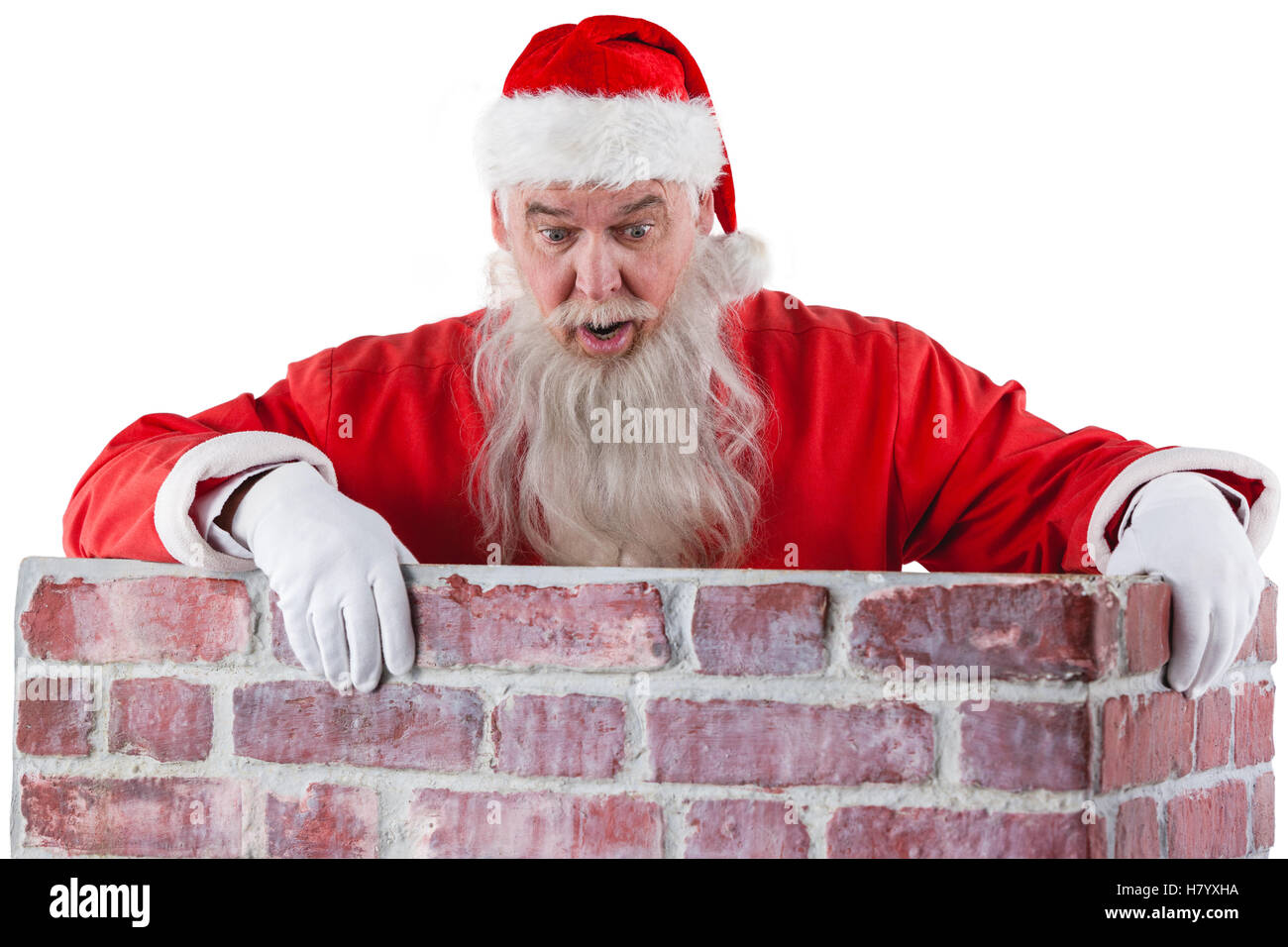 Santa claus peeking over the wall Stock Photo - Alamy