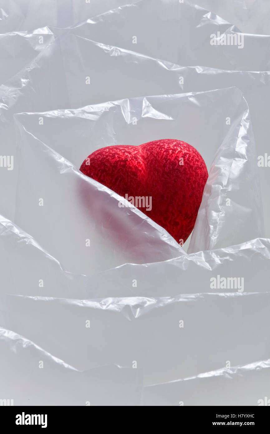 Heart surrounded by air-filled protective packaging, fragile, sensitive ...