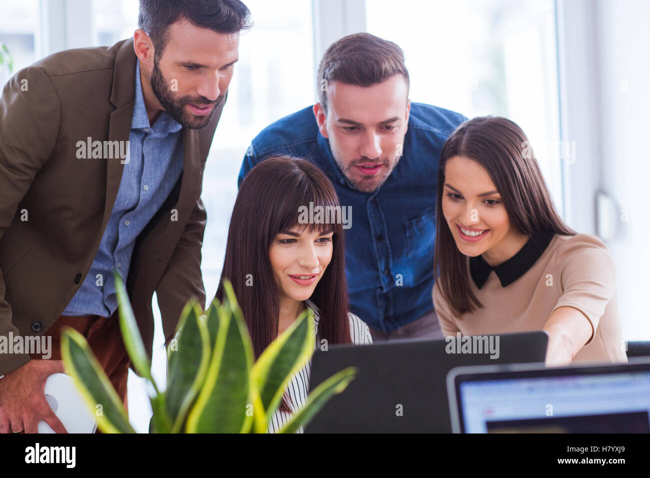 Men and Women working in office Stock Photo - Alamy
