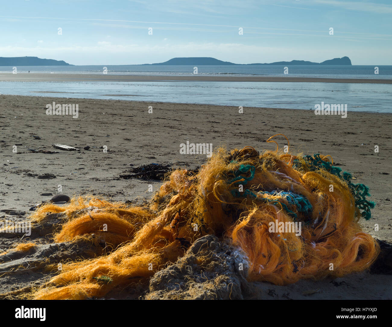 Plastic fishing netting on sandy beach Stock Photo - Alamy