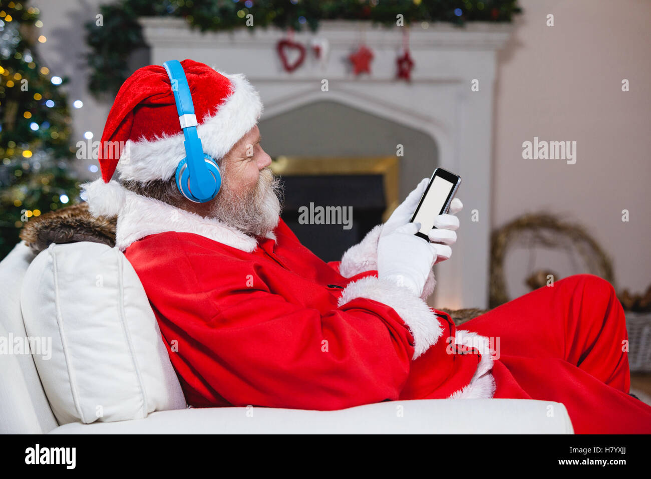 Santa claus smartphone christmas tree hi-res stock photography and ...