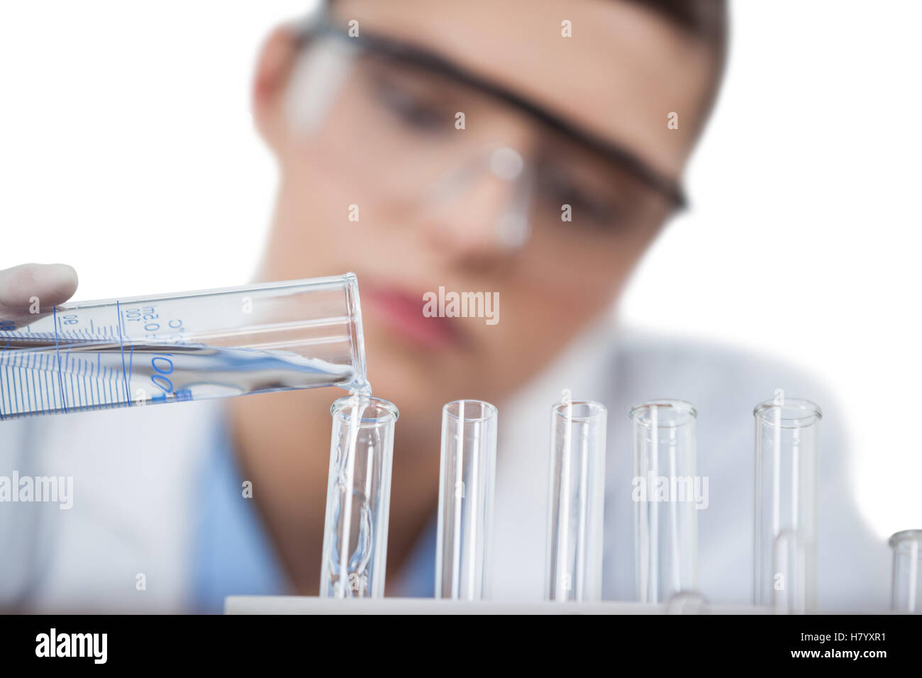 Female scientist conducting an experiment Stock Photo - Alamy