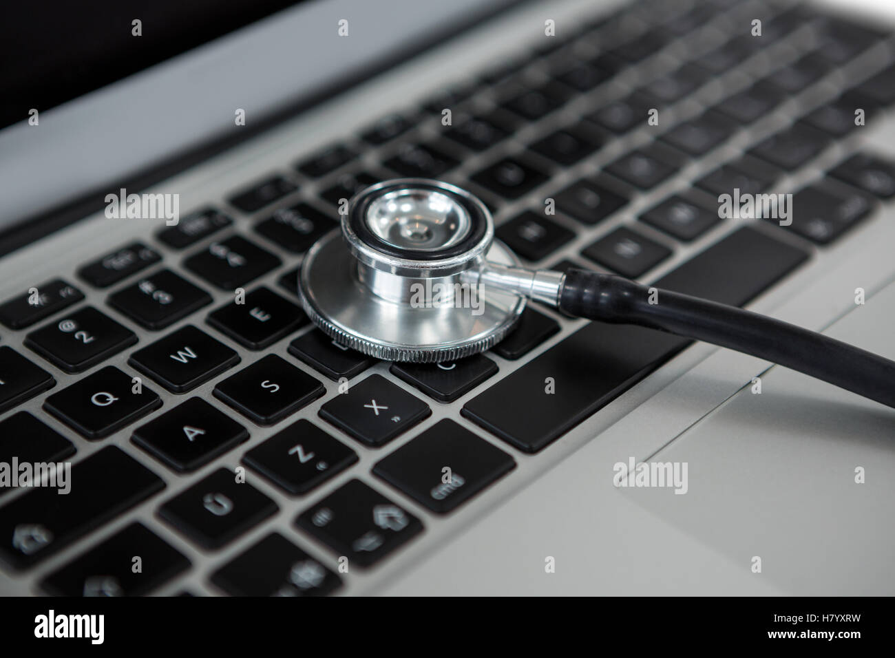 Stethoscope on laptop Stock Photo - Alamy