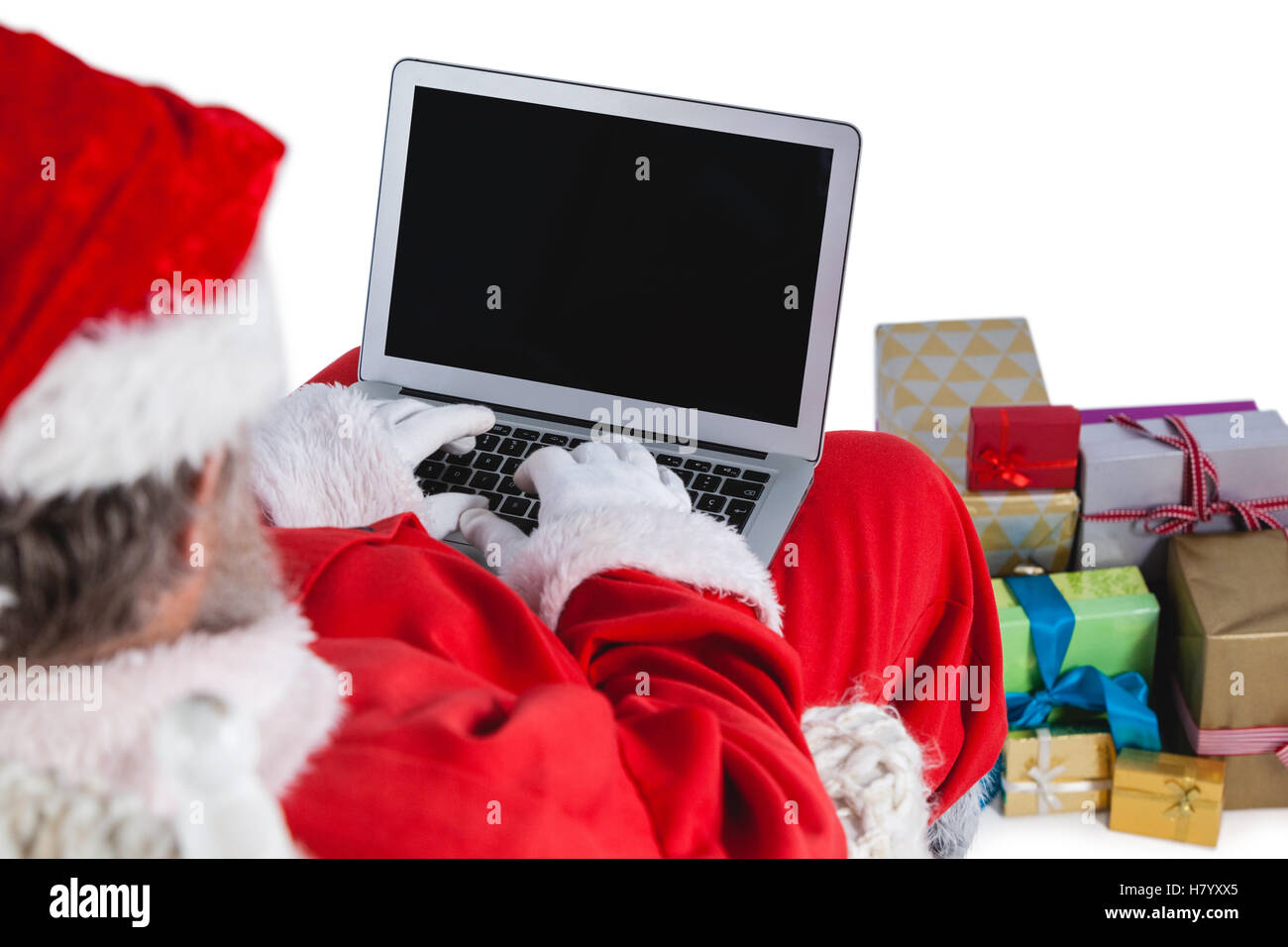 Santa claus using laptop Stock Photo - Alamy