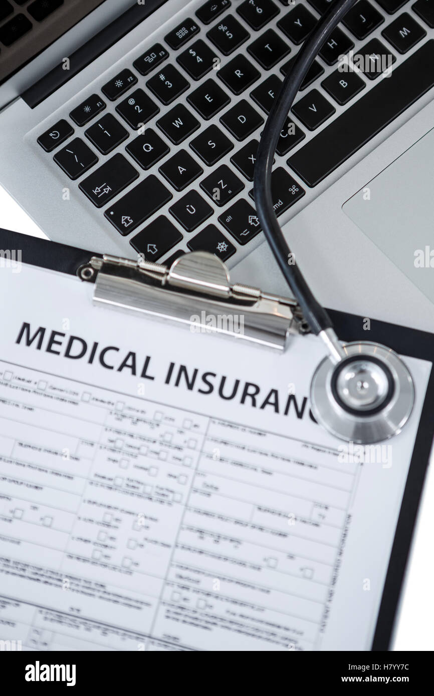 Clipboard with medical insurance paper, stethoscope and laptop Stock ...