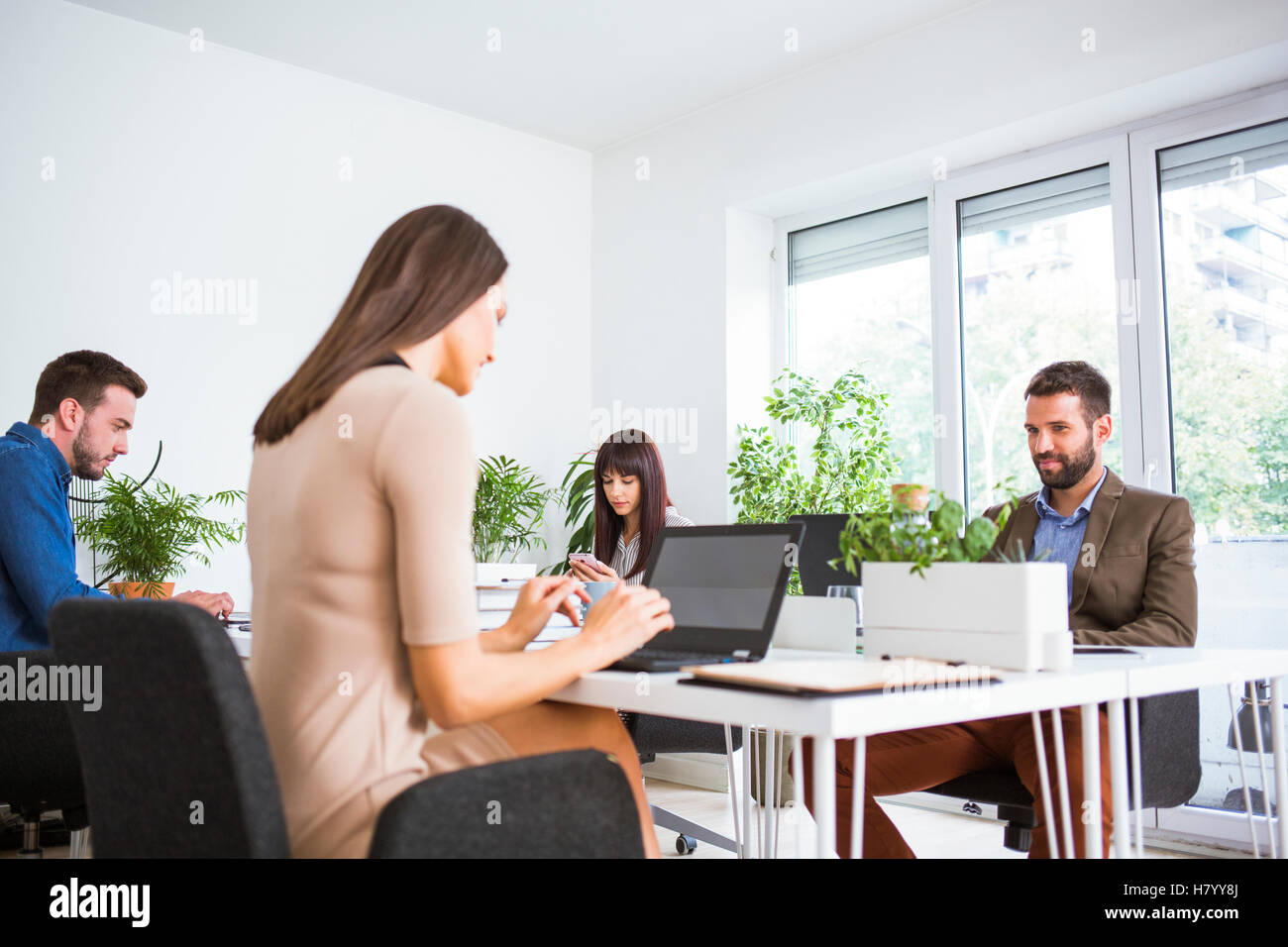 Men and women working in office Stock Photo - Alamy