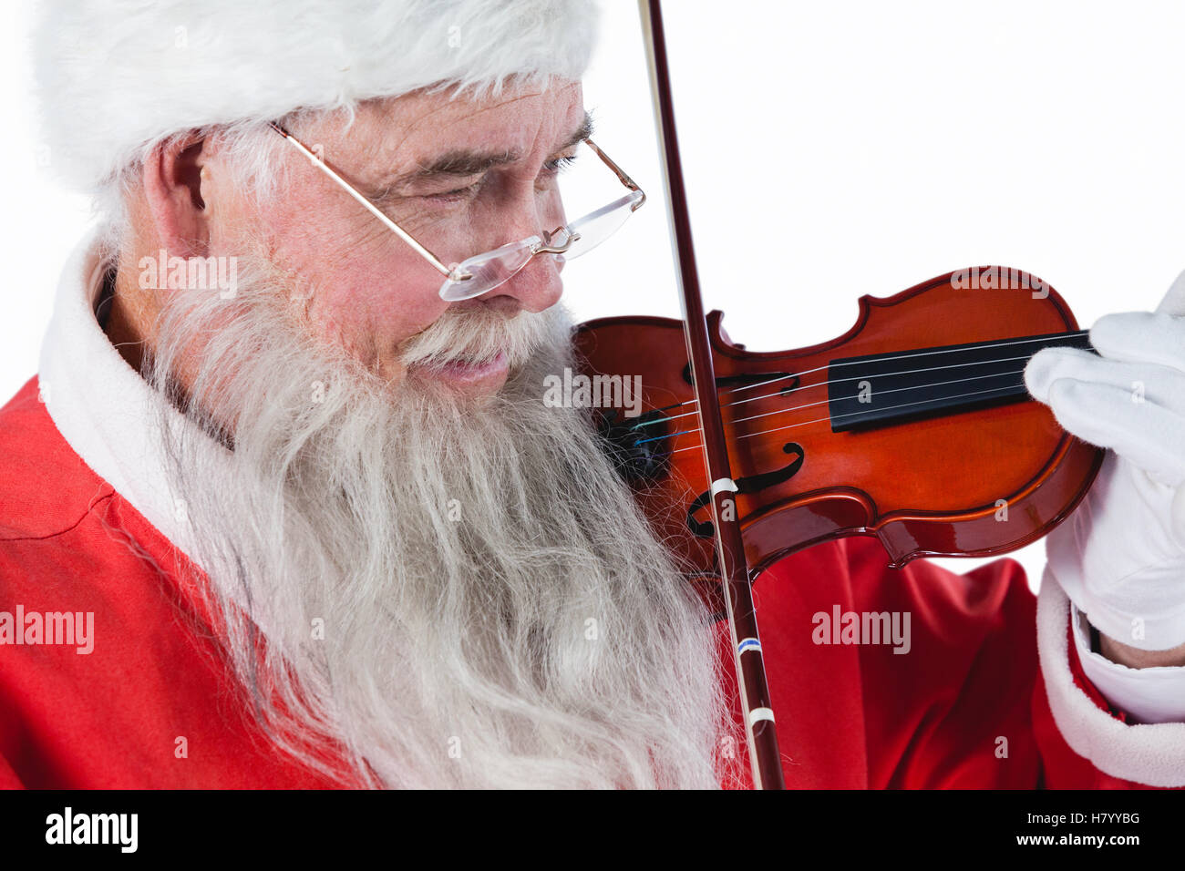 Smiling santa claus playing violin Stock Photo - Alamy