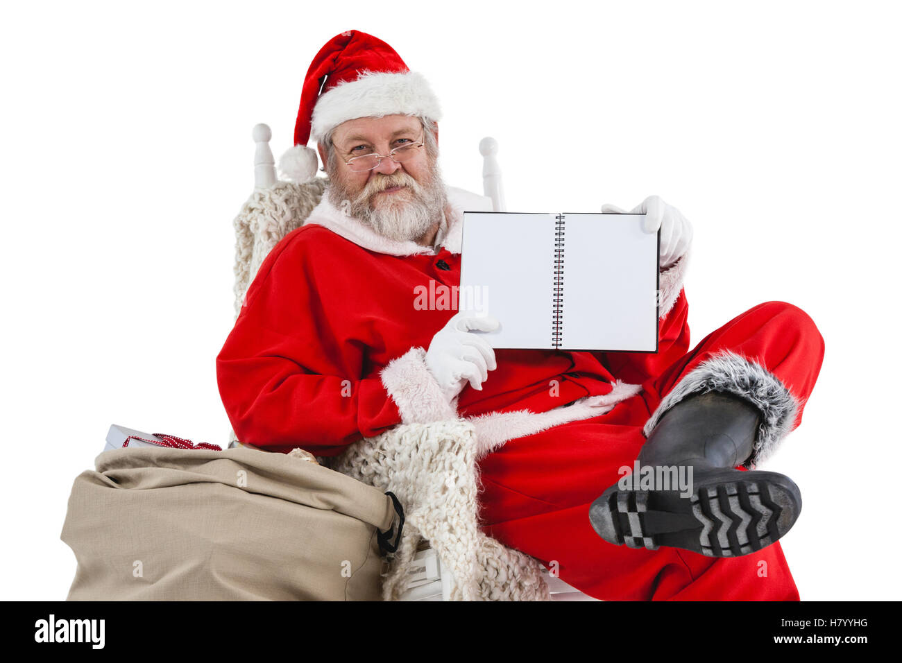 Santa claus holding a diary Stock Photo - Alamy