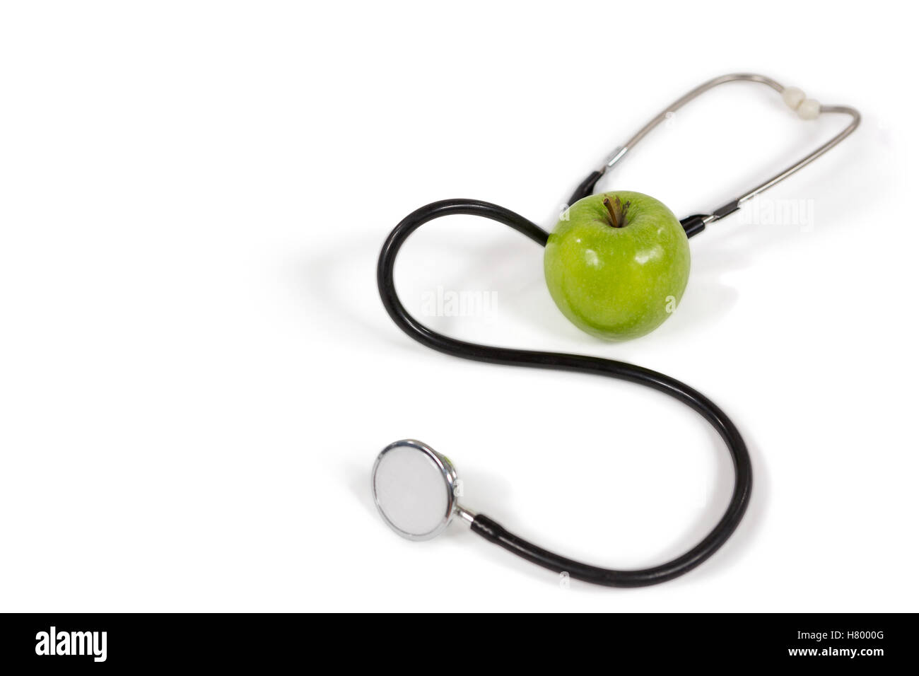Stethoscope and apple on white background Stock Photo - Alamy