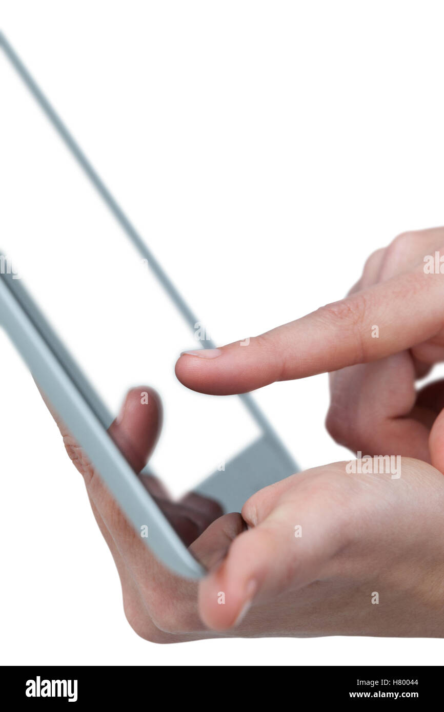 Hands using digital tablet against white background Stock Photo - Alamy