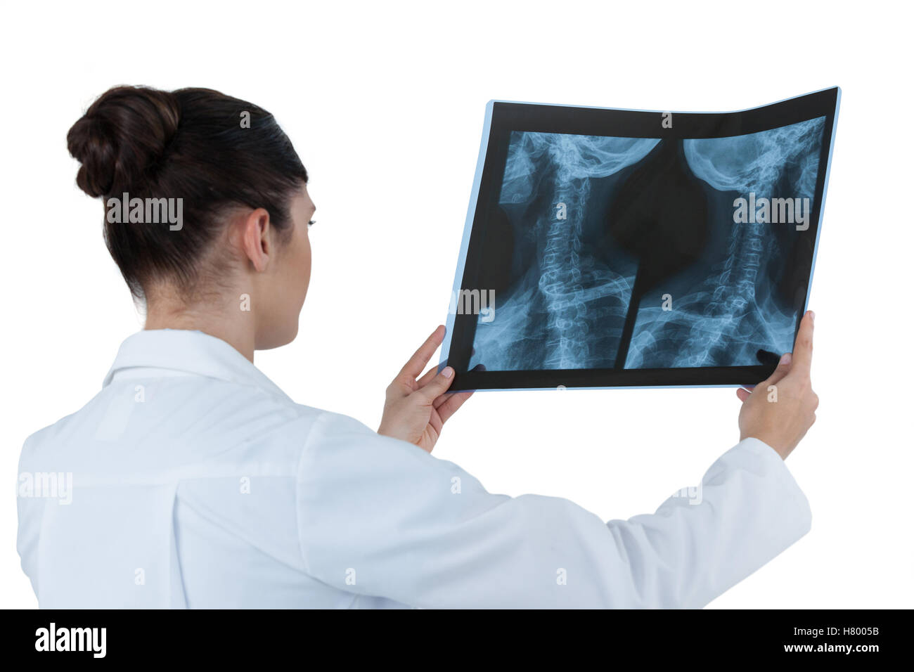 Female doctor checking x-ray report Stock Photo - Alamy