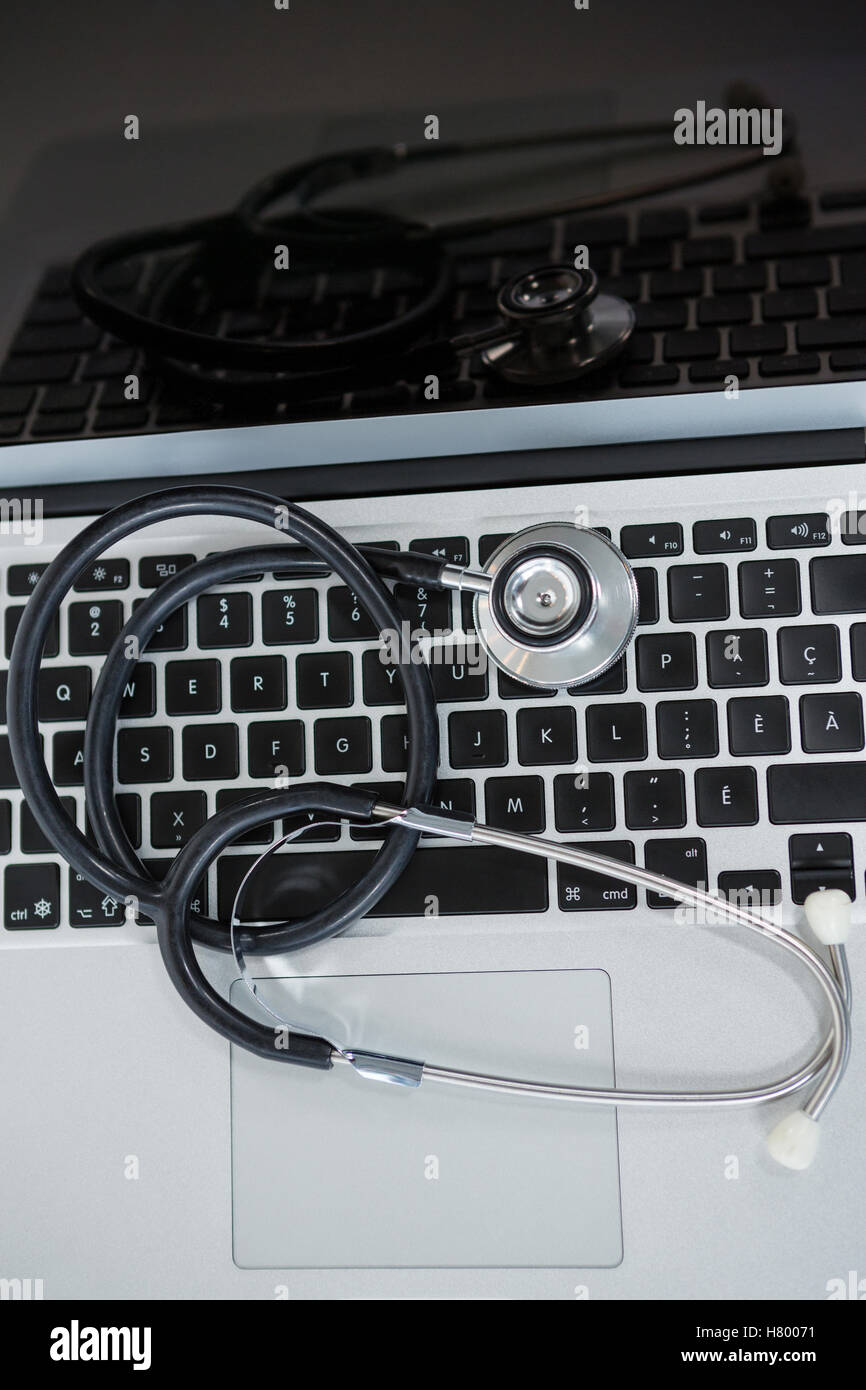 Stethoscope on laptop Stock Photo - Alamy