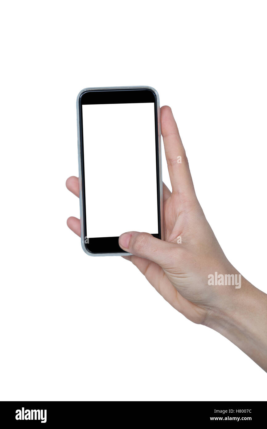 Hand holding mobile phone against white background Stock Photo - Alamy