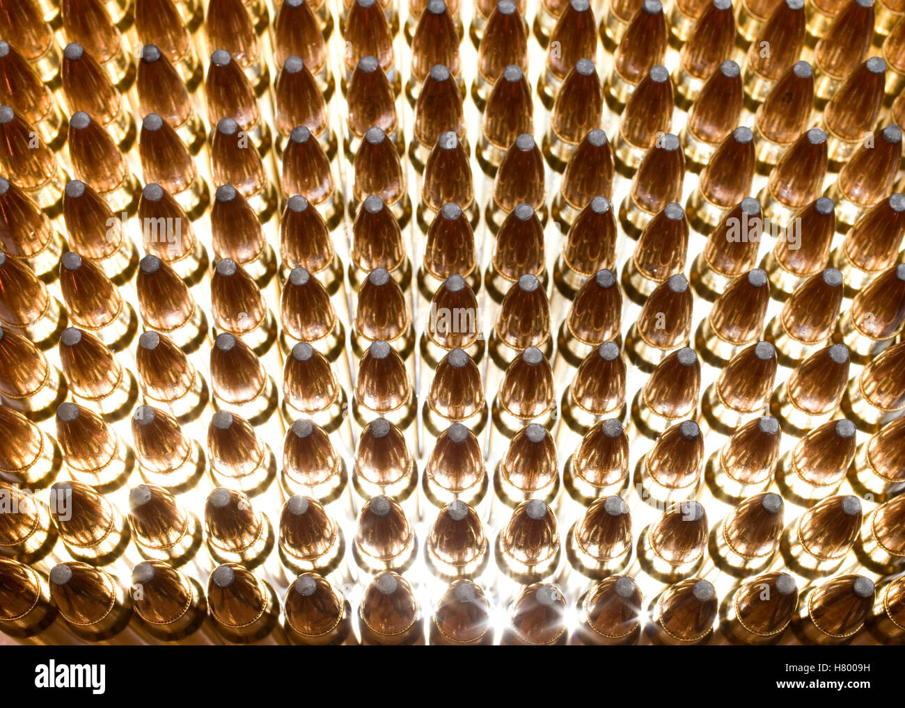 three thirty eight cartridges loaded with light from behind Stock Photo ...