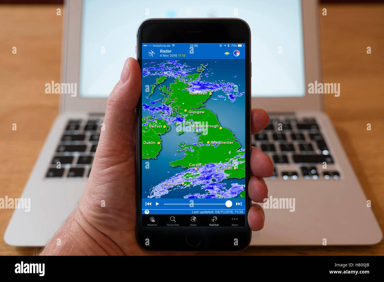 Using iPhone smartphone to display weather radar image of rain across ...