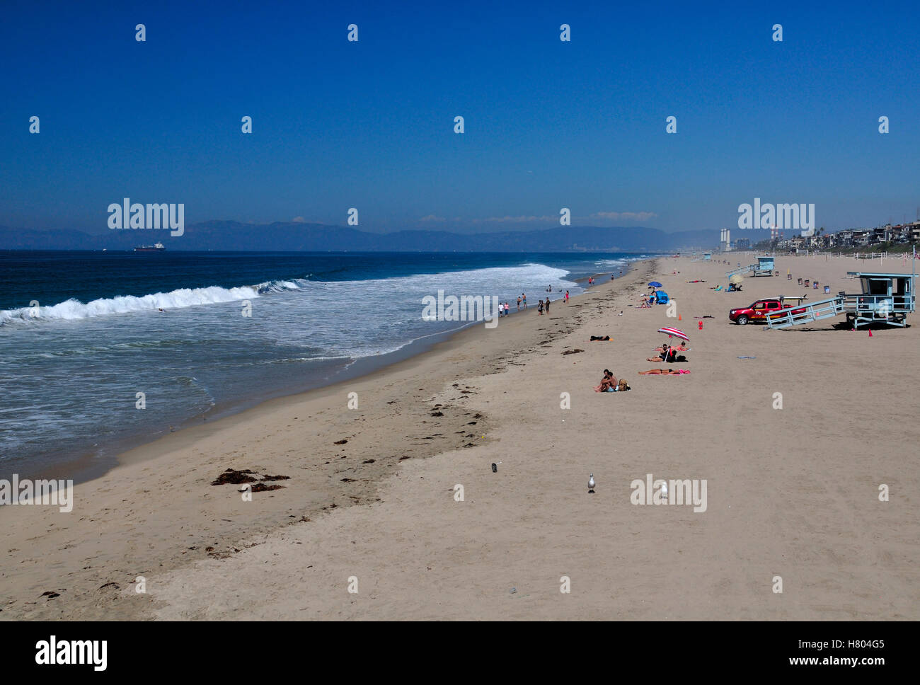 September 30, 2016. Manhattan Beach, California. Sunbathing and the ...