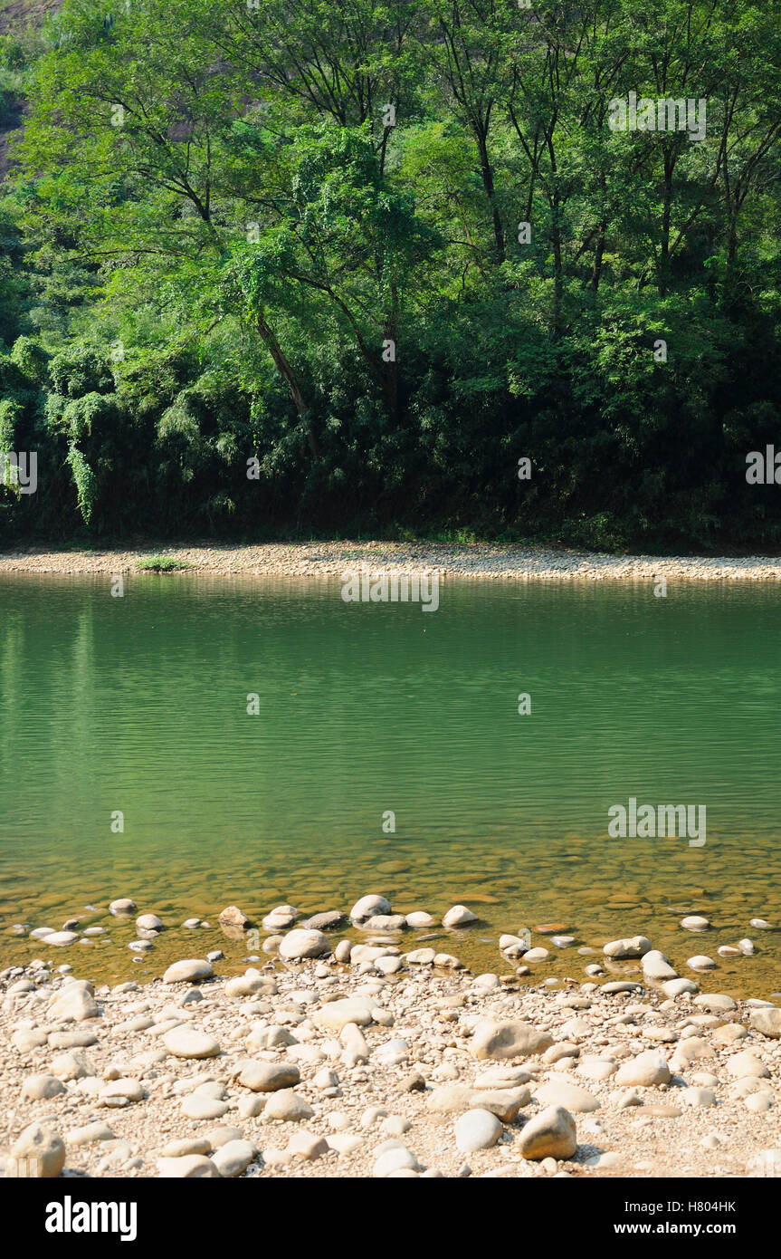 The emerald green water of the Nine Bend River or Jiuxi river through ...