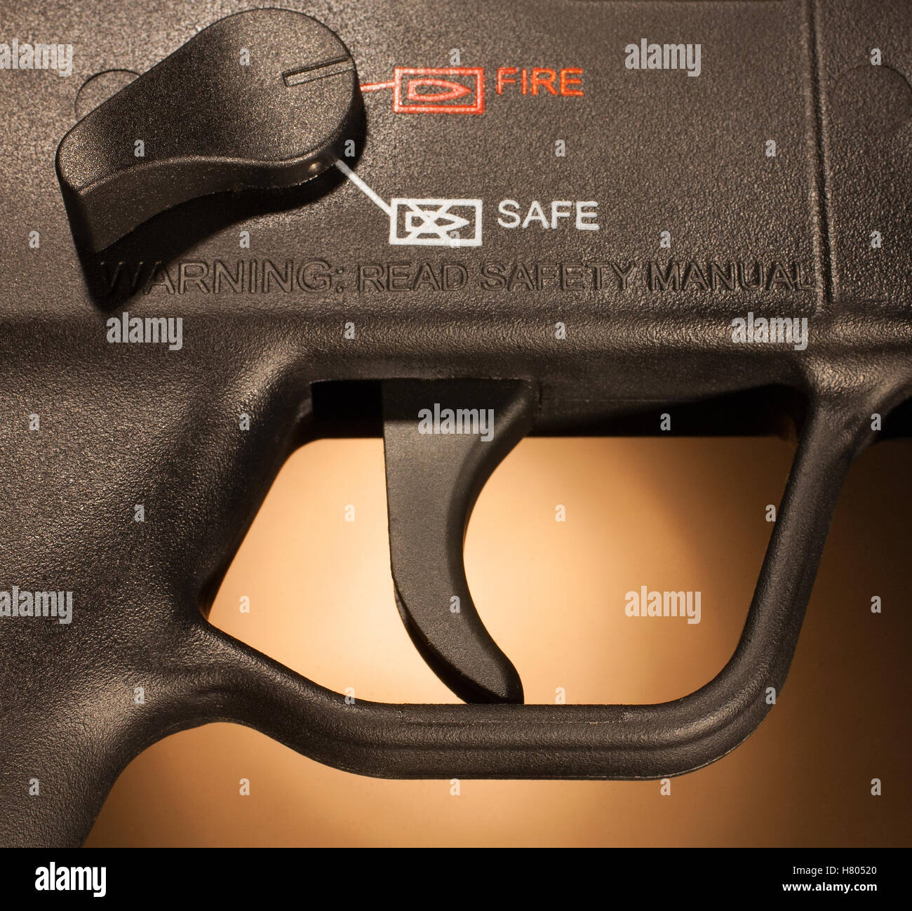 Trigger on an assault rifle with the safety on fire Stock Photo - Alamy