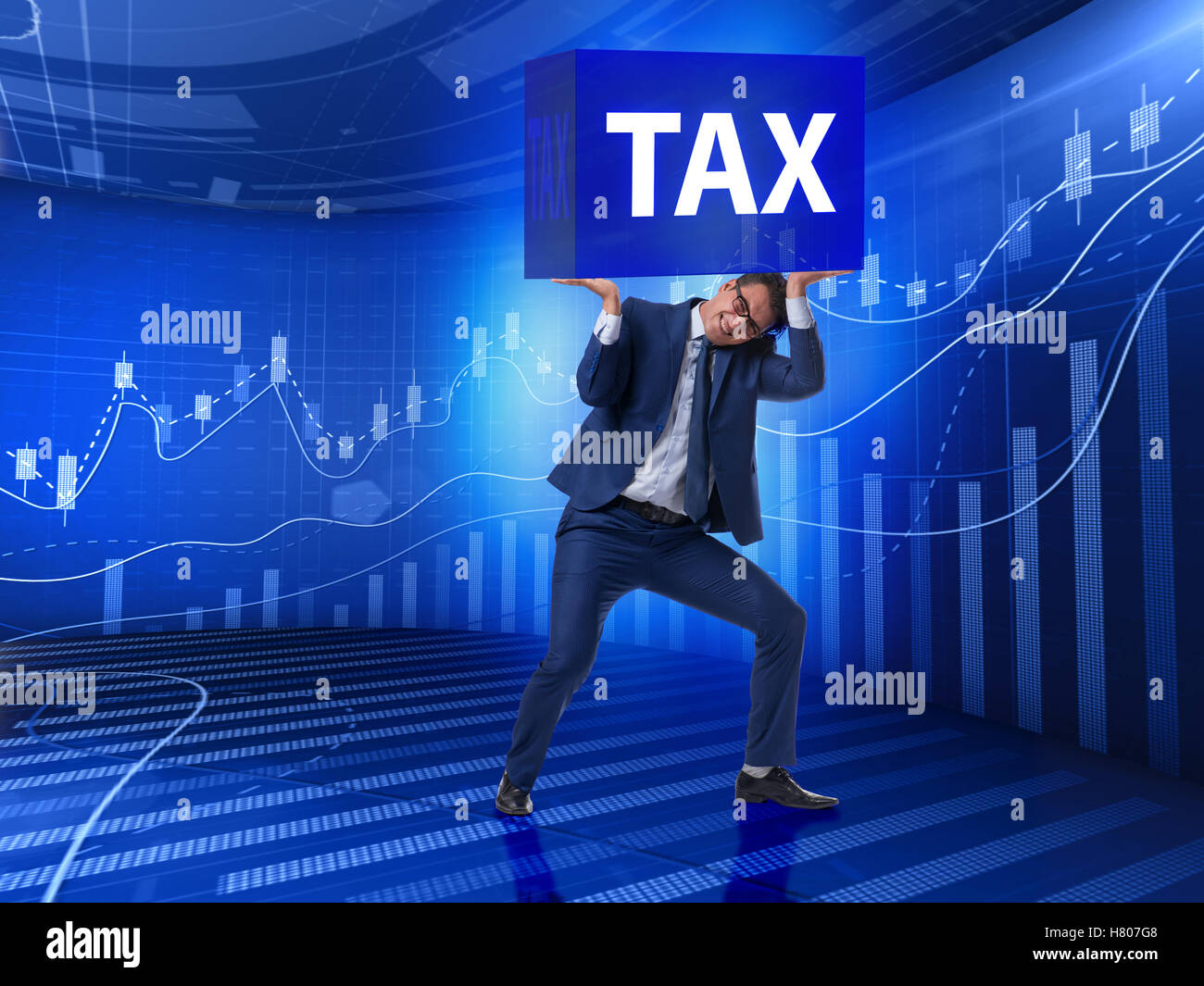 Man under the burden of tax payments Stock Photo - Alamy