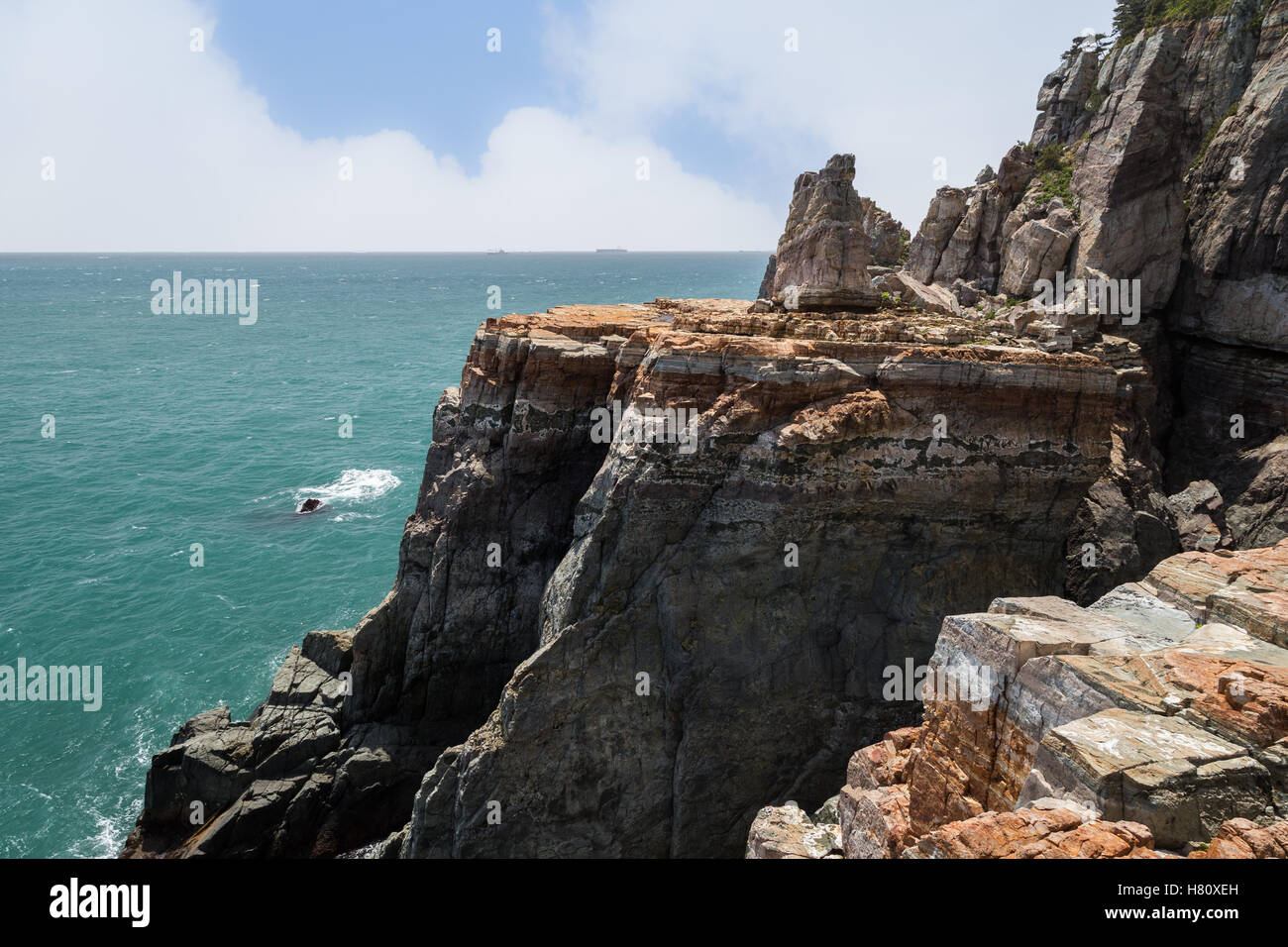 View of rocky, rugged and steep cliff and ocean at the Taejongdae ...