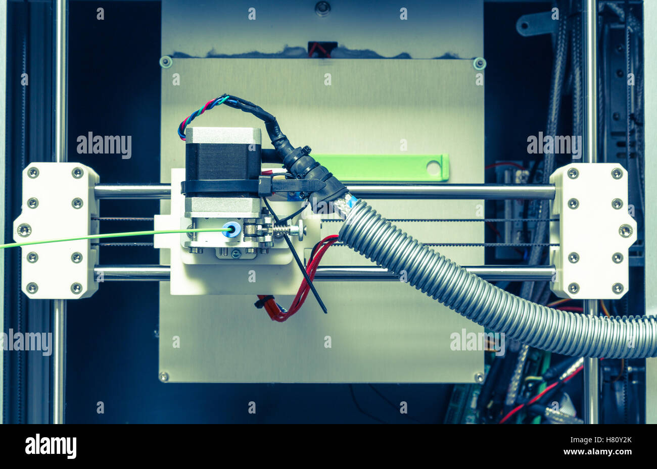3d printer with bright green filament Stock Photo - Alamy