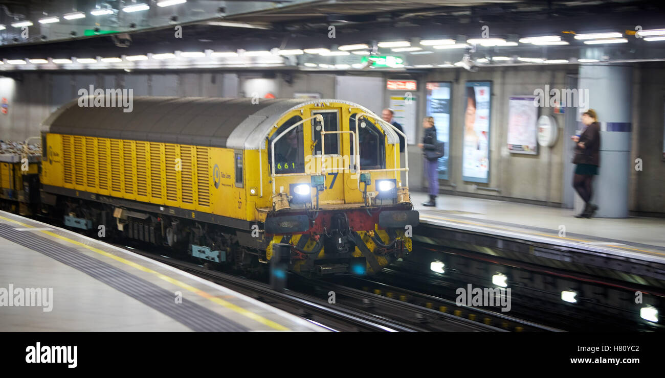 A London Underground rail grinding maintenance train passes through ...