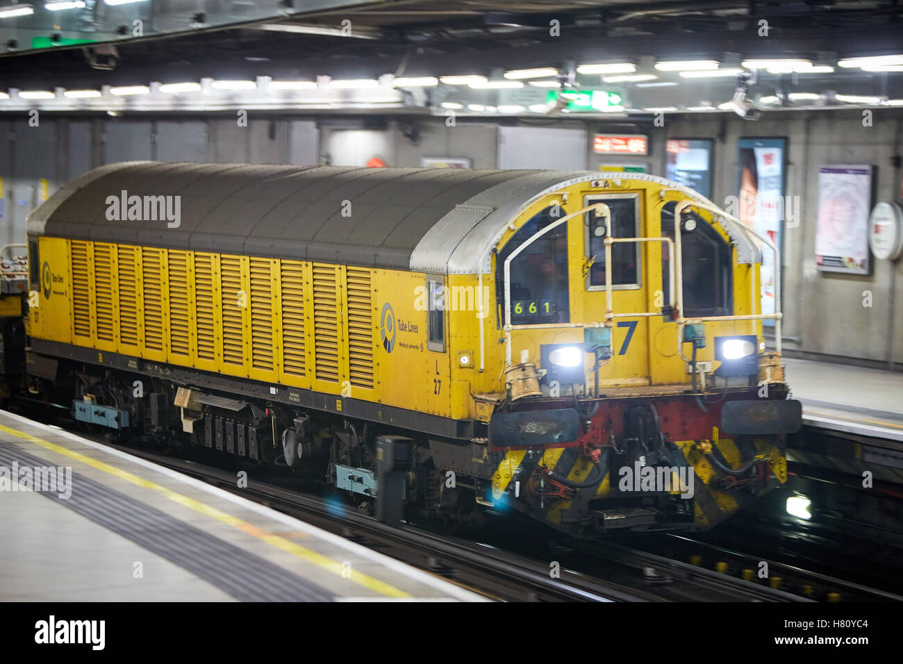 A London Underground rail grinding maintenance train passes through ...
