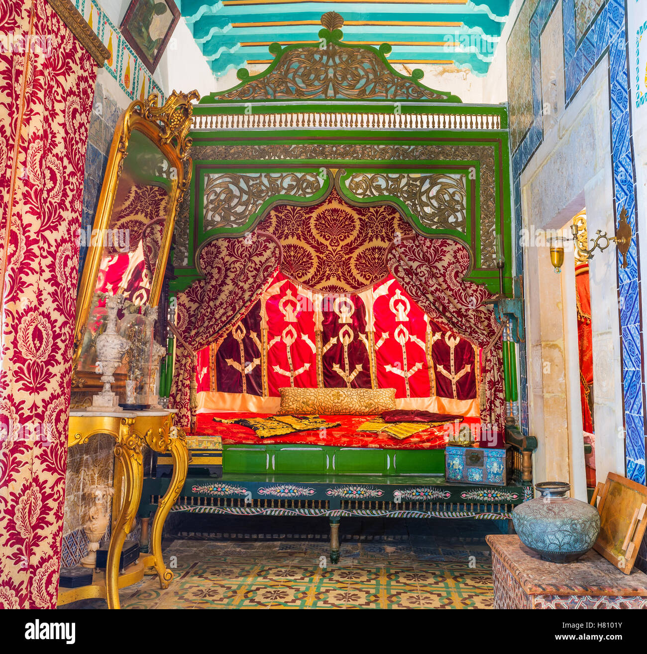 The wife's bedroom in Dar Essid mansion with carved wooden bed and ...